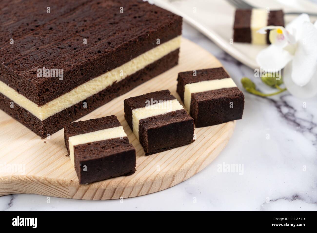 Three layer steam chocolate cheese cake Stock Photo - Alamy