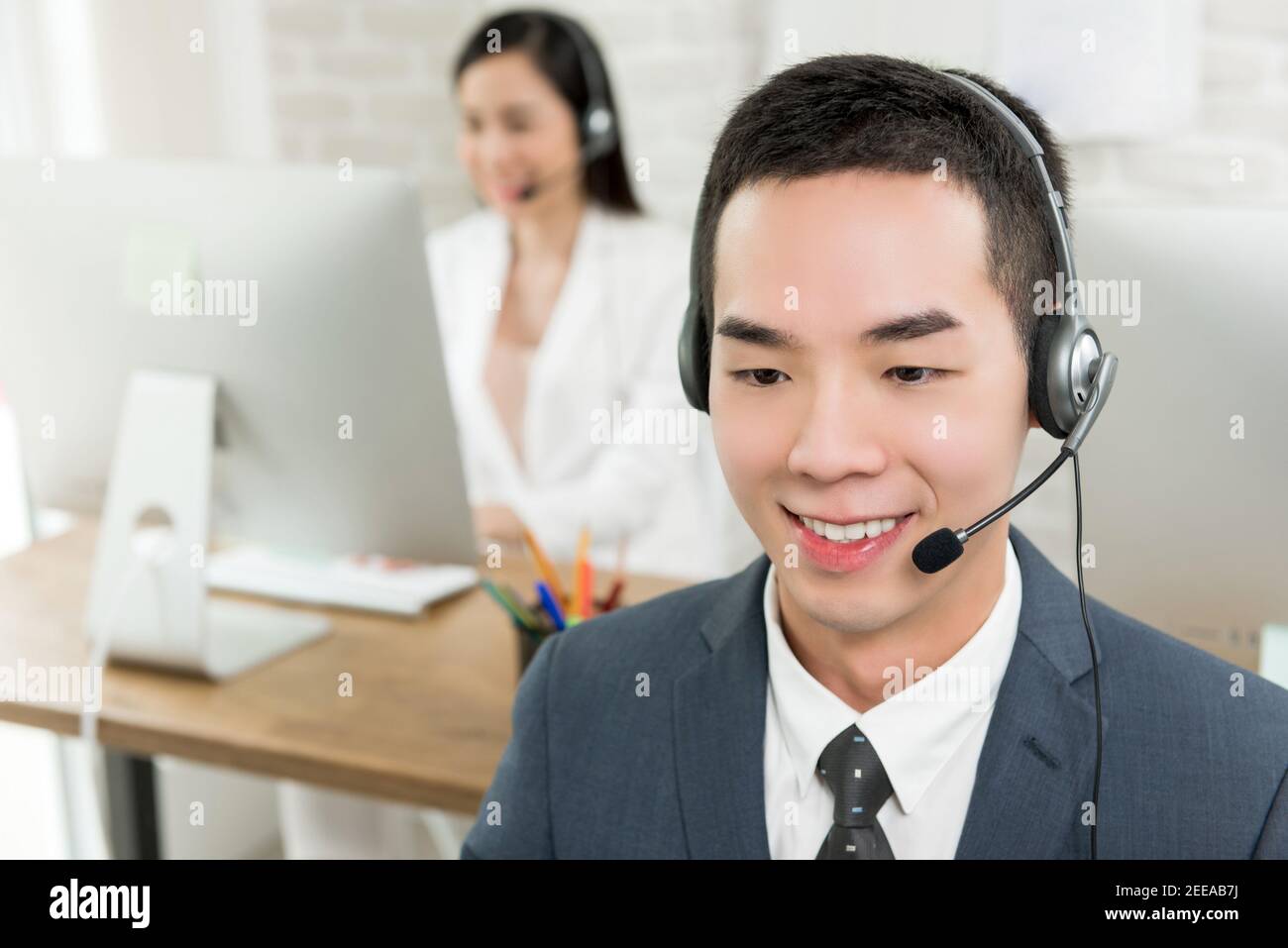 Happy chinese customer support team hi-res stock photography and images ...