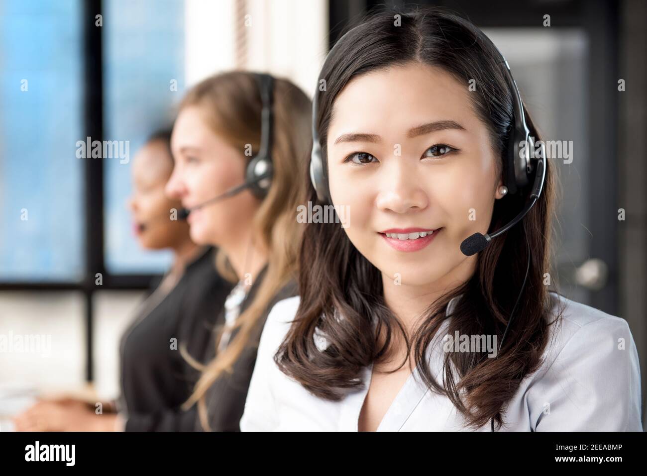 Smiling Beautiful Asian Woman Telemarketing Customer Service Agent