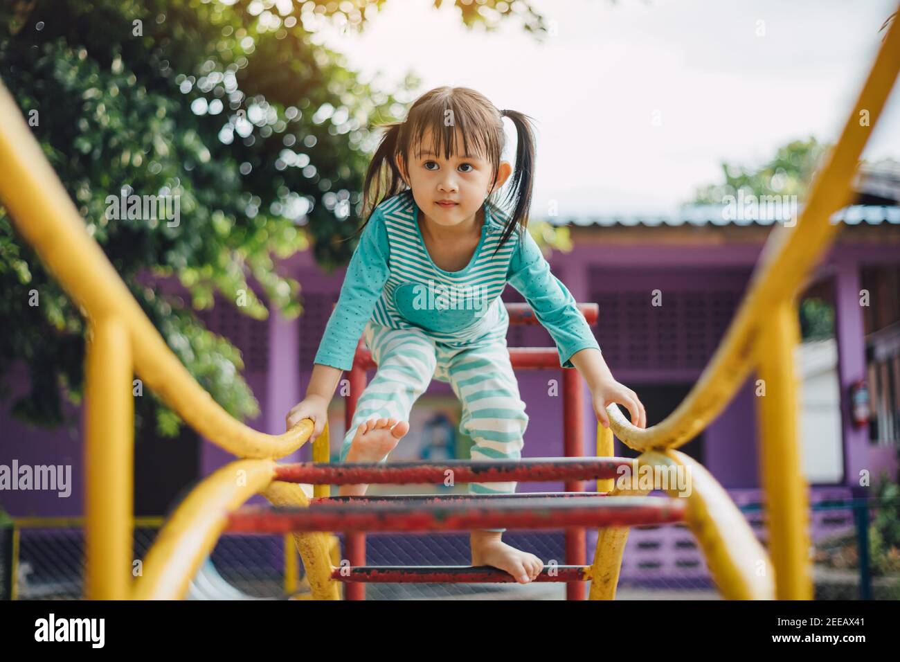 School kids play and learn in the playgound. Physical activity like ...