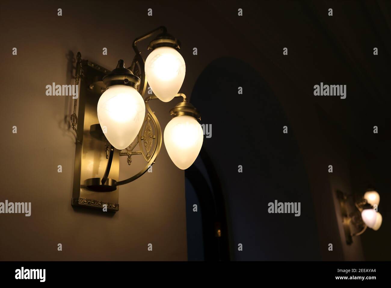 Details of hotel wall lamp at night Stock Photo - Alamy