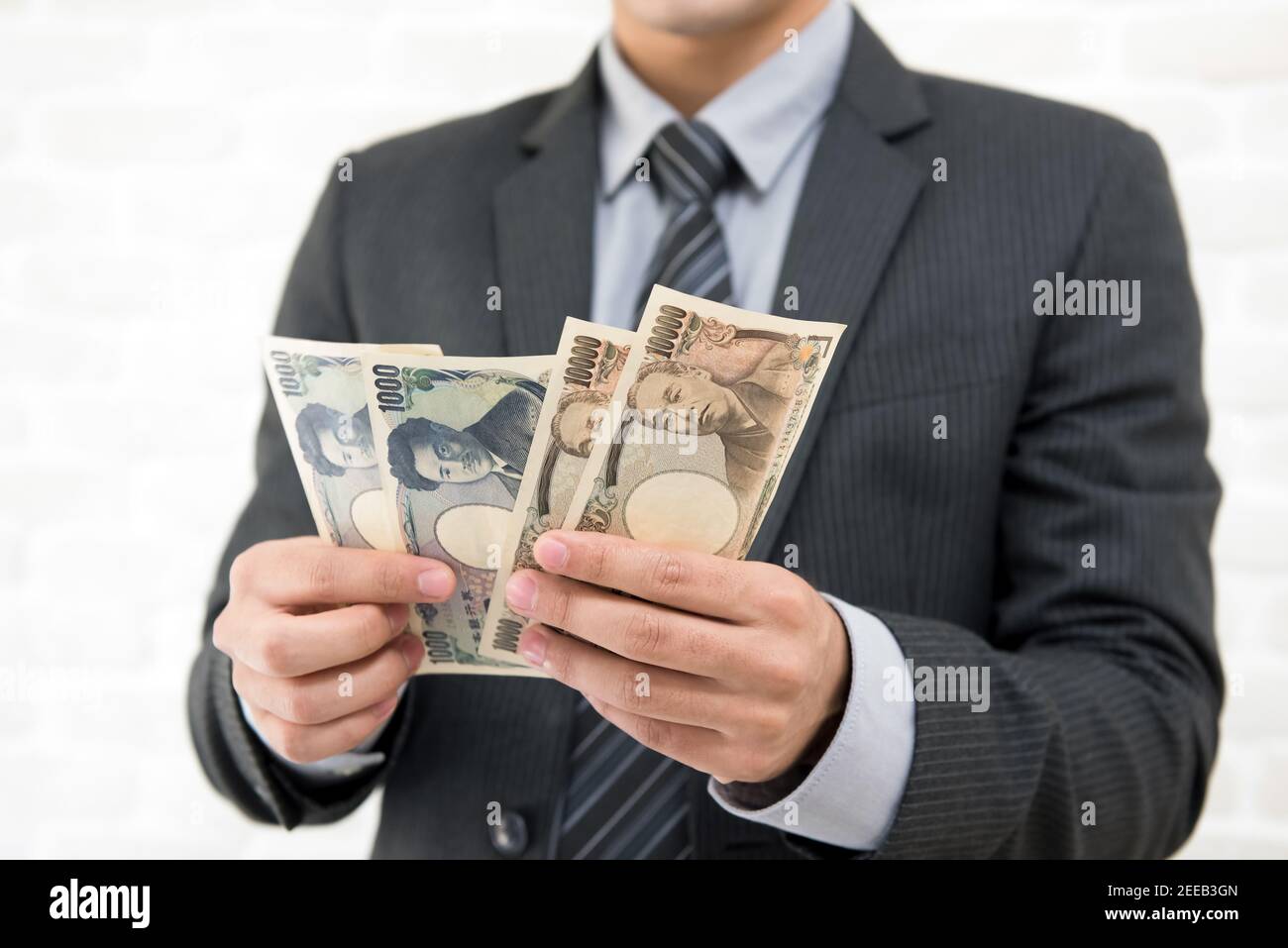 Man counting money rich suit hi-res stock photography and images - Alamy