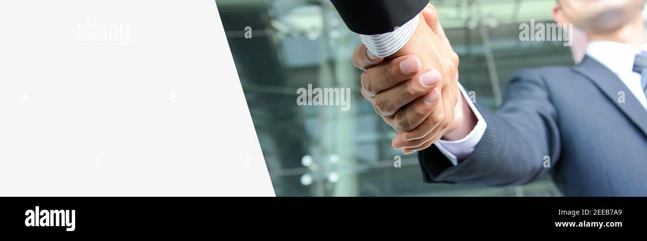Handshake of businessmen, panoramic banner background with copy space ...