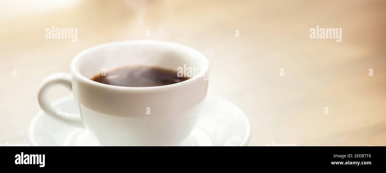 Hot black espresso coffee in the cup on wooden table, panoramic banner ...