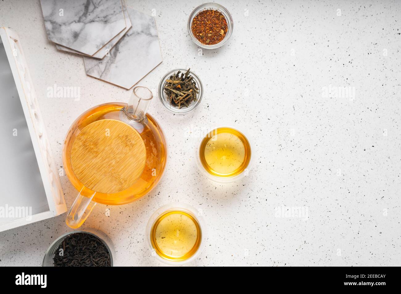 light tea flatley. pour black tea into thermos cups, on a light ...