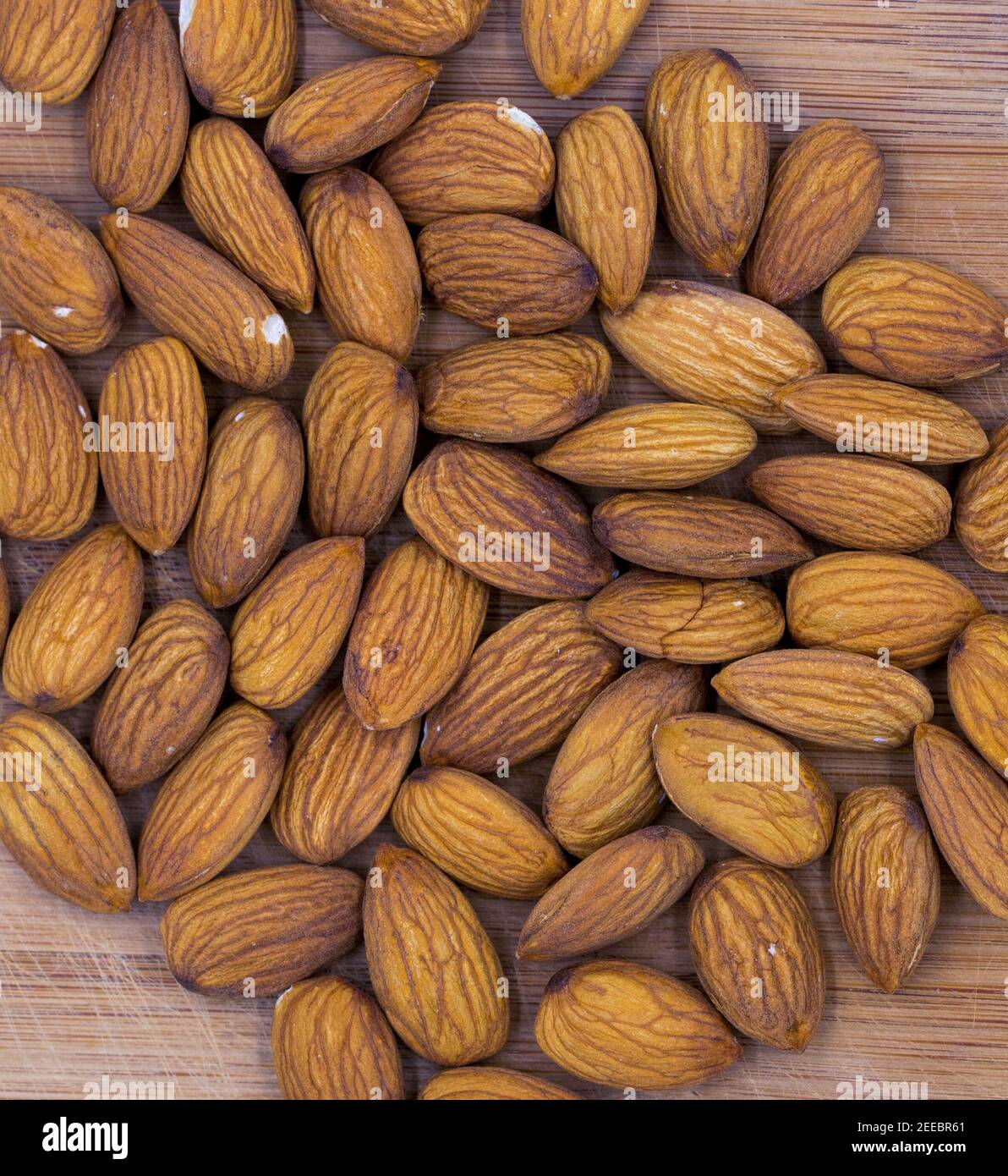 Almond nuts on timber background, top view photo. Tasty healthy snack ...