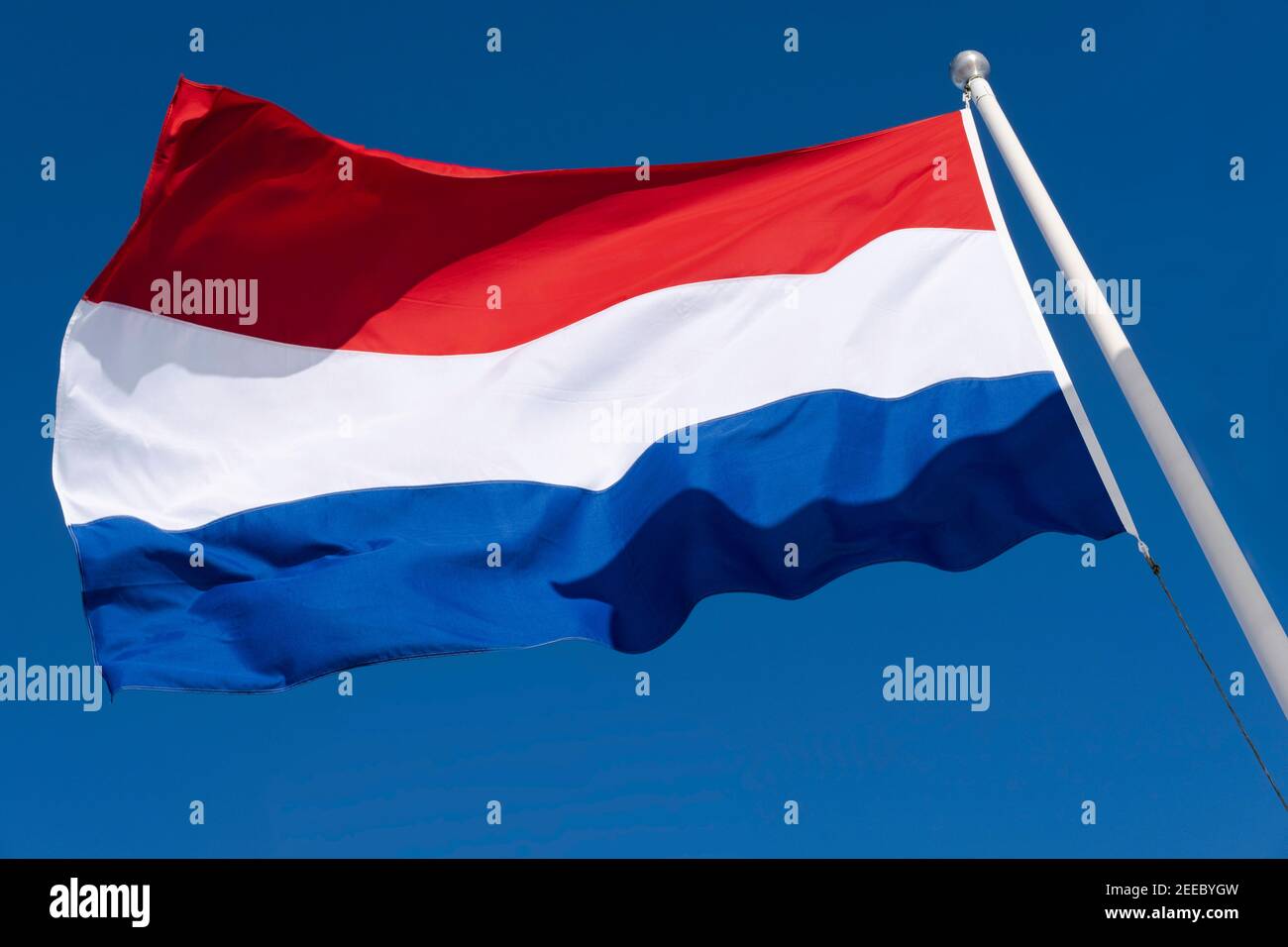 Dutch flag, the tricolor with red, white and blue stripes, flutters ...