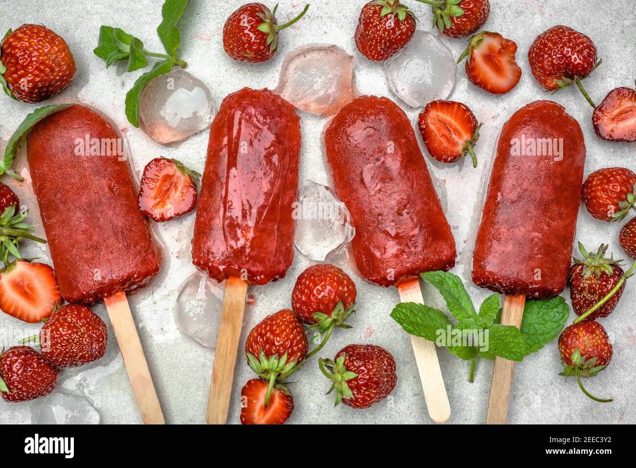 Fresh fruit popsicles with strawberry frozen sorbet. Ice juice popsicle ...