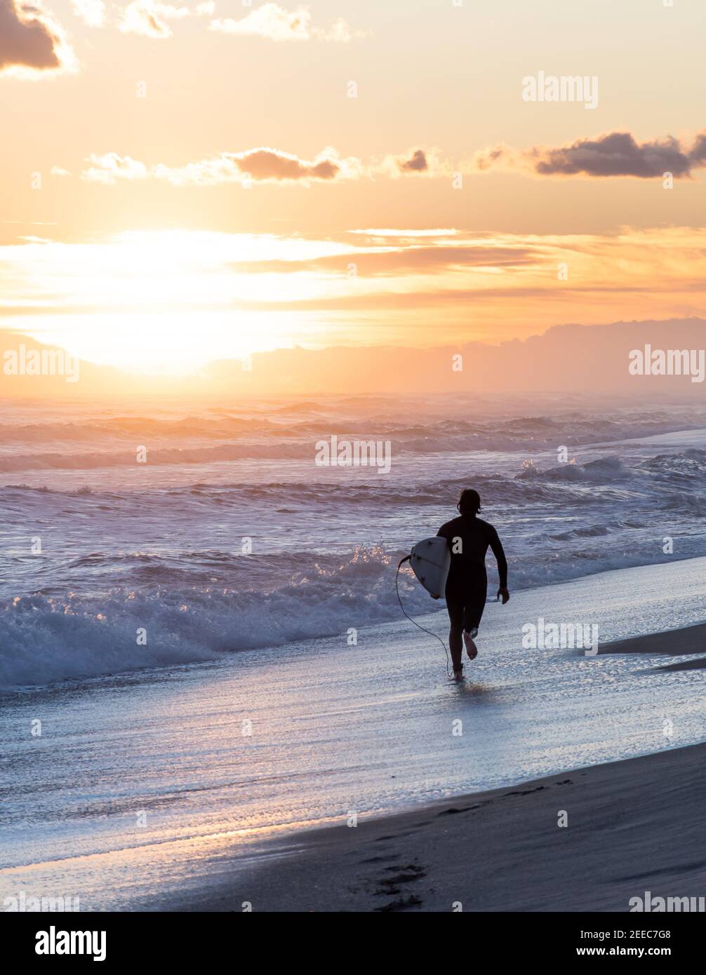 Running carrying surf board surfboard hi-res stock photography and ...
