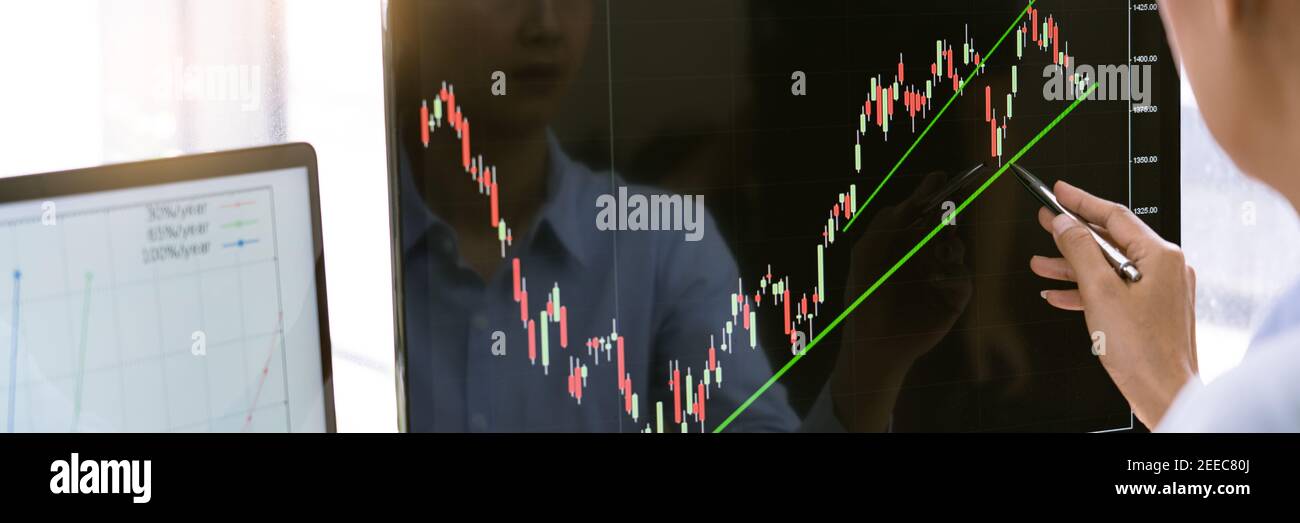stock exchange trader working with graphs,diagrams on monitor in modern ...
