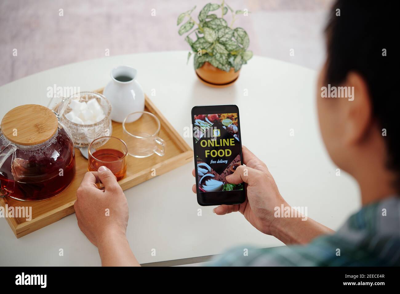 Man ordering food online Stock Photo - Alamy