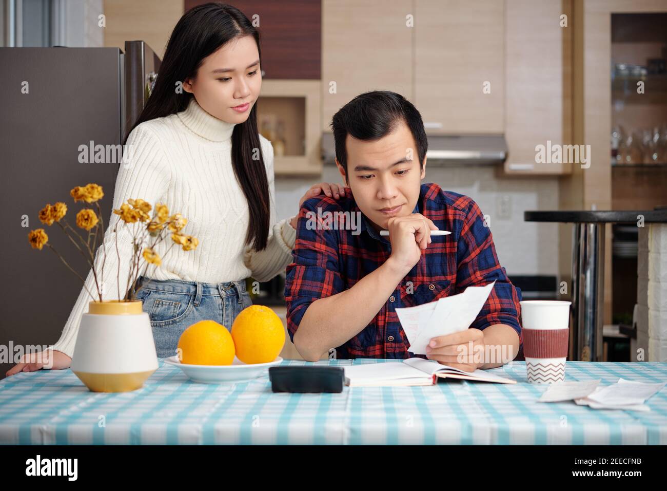 Couple managing home finances Stock Photo - Alamy
