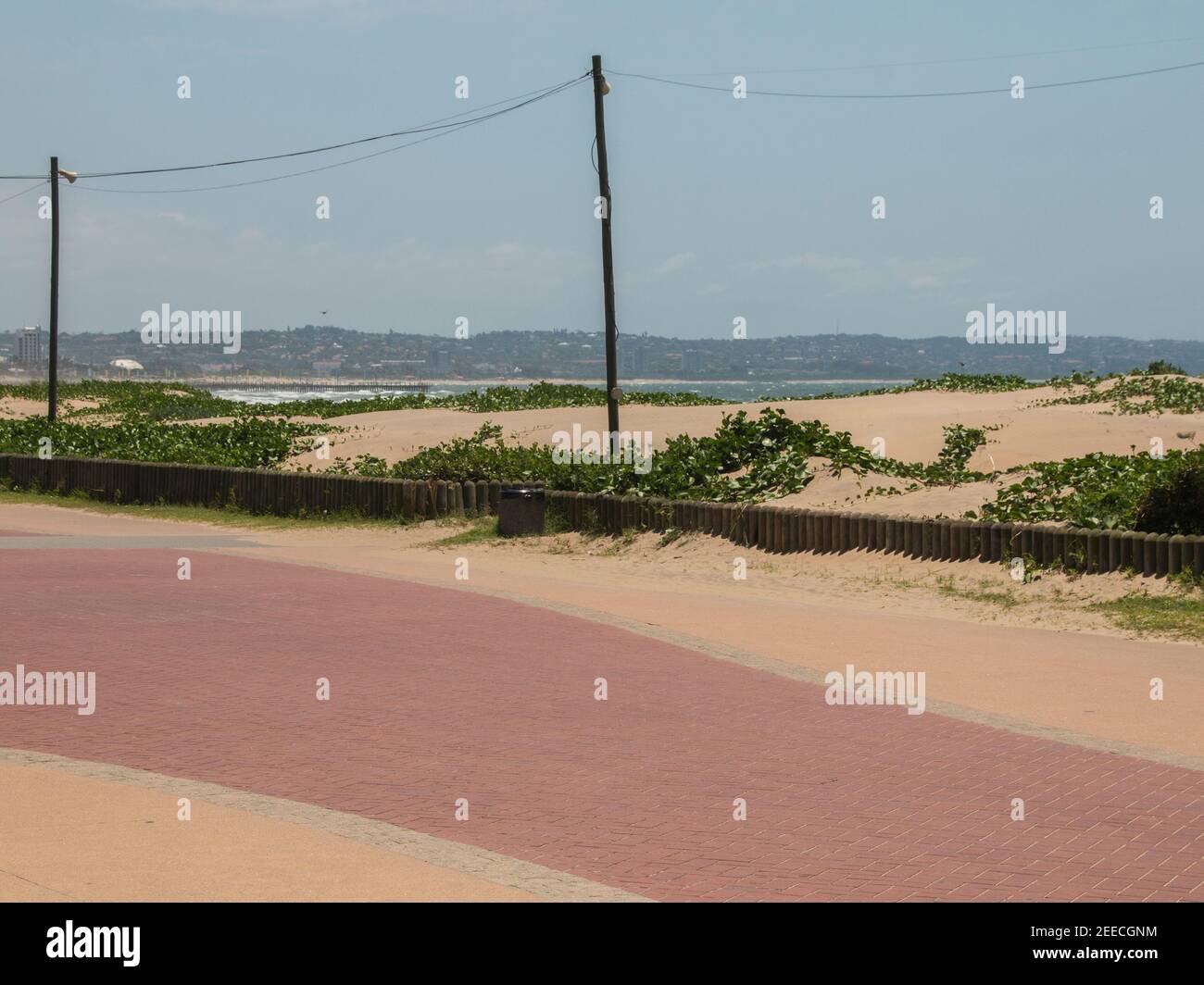 Paved promenade with dunes behind at durban beachfront Stock Photo - Alamy