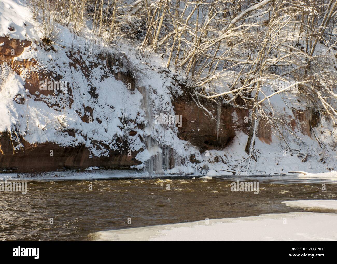 beautiful sunny day, landscape with red sandstone cliffs that are snowy ...