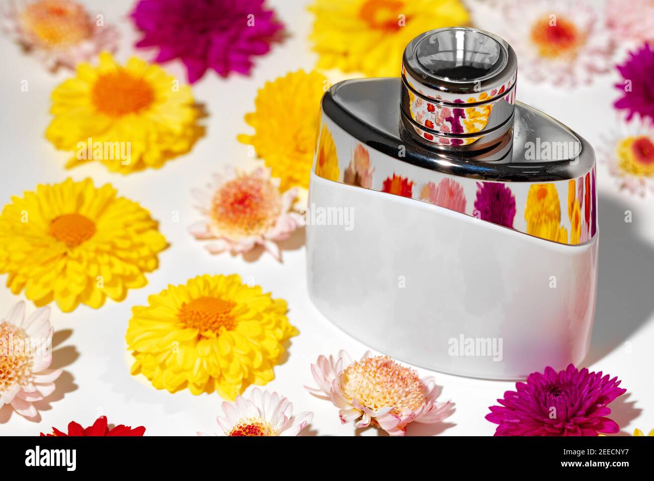 Perfume bottle for women in flower buds Stock Photo - Alamy