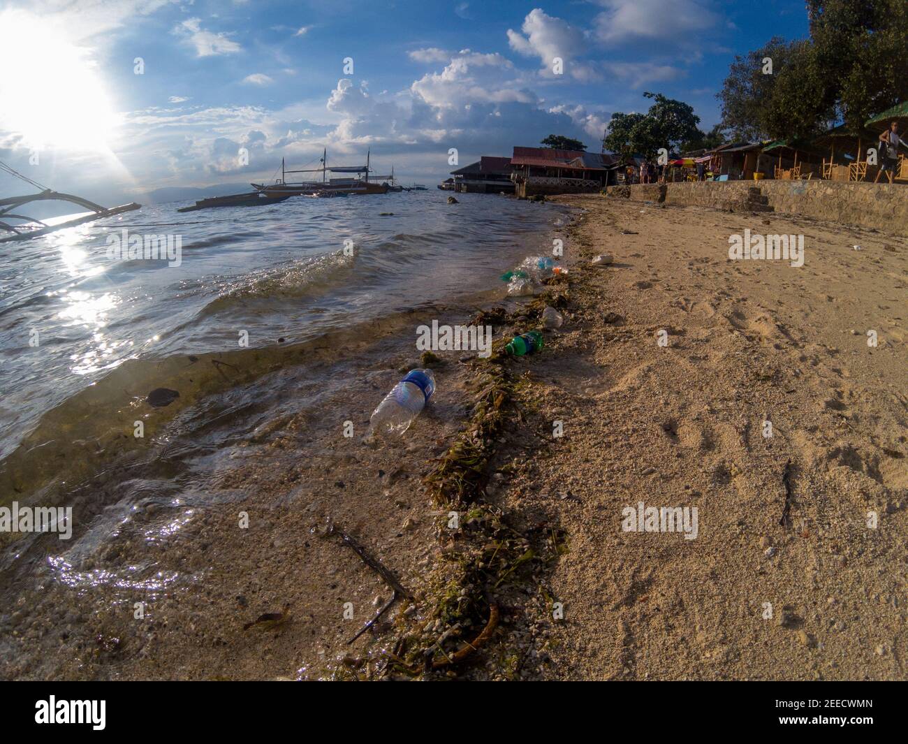 Moalboal, the Philippines - plastic and glass trash on sea beach. Human ...