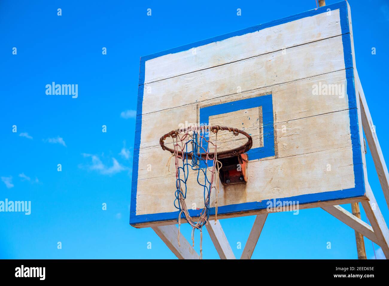 Basketball backboard on blue sky background. Rustic outdoor sport ...