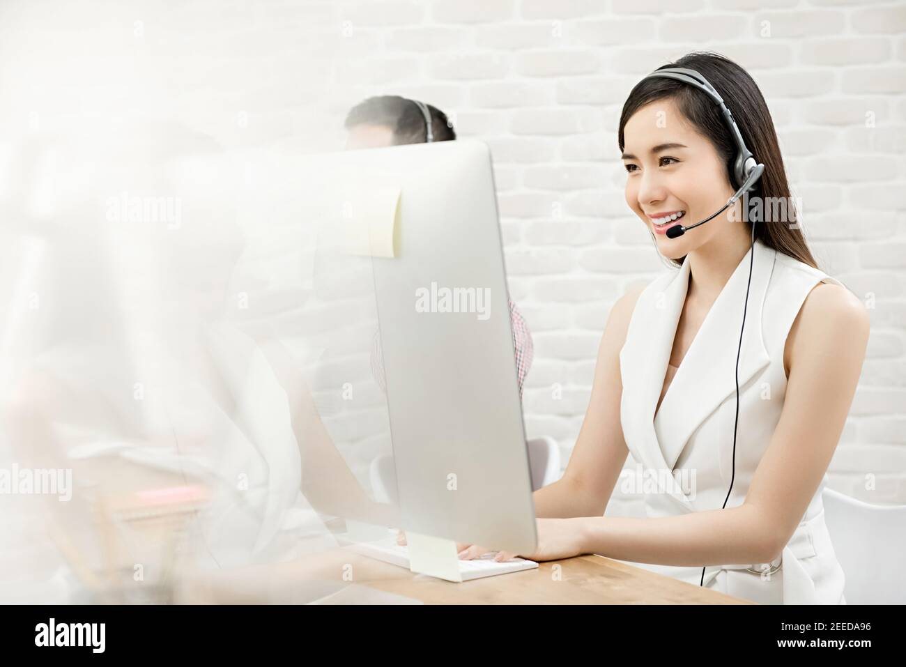 Asian female agent talking hi-res stock photography and images - Alamy