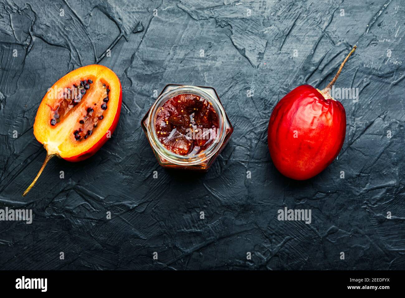 Delicious exotic tamarillo jam in a glass jar Stock Photo - Alamy
