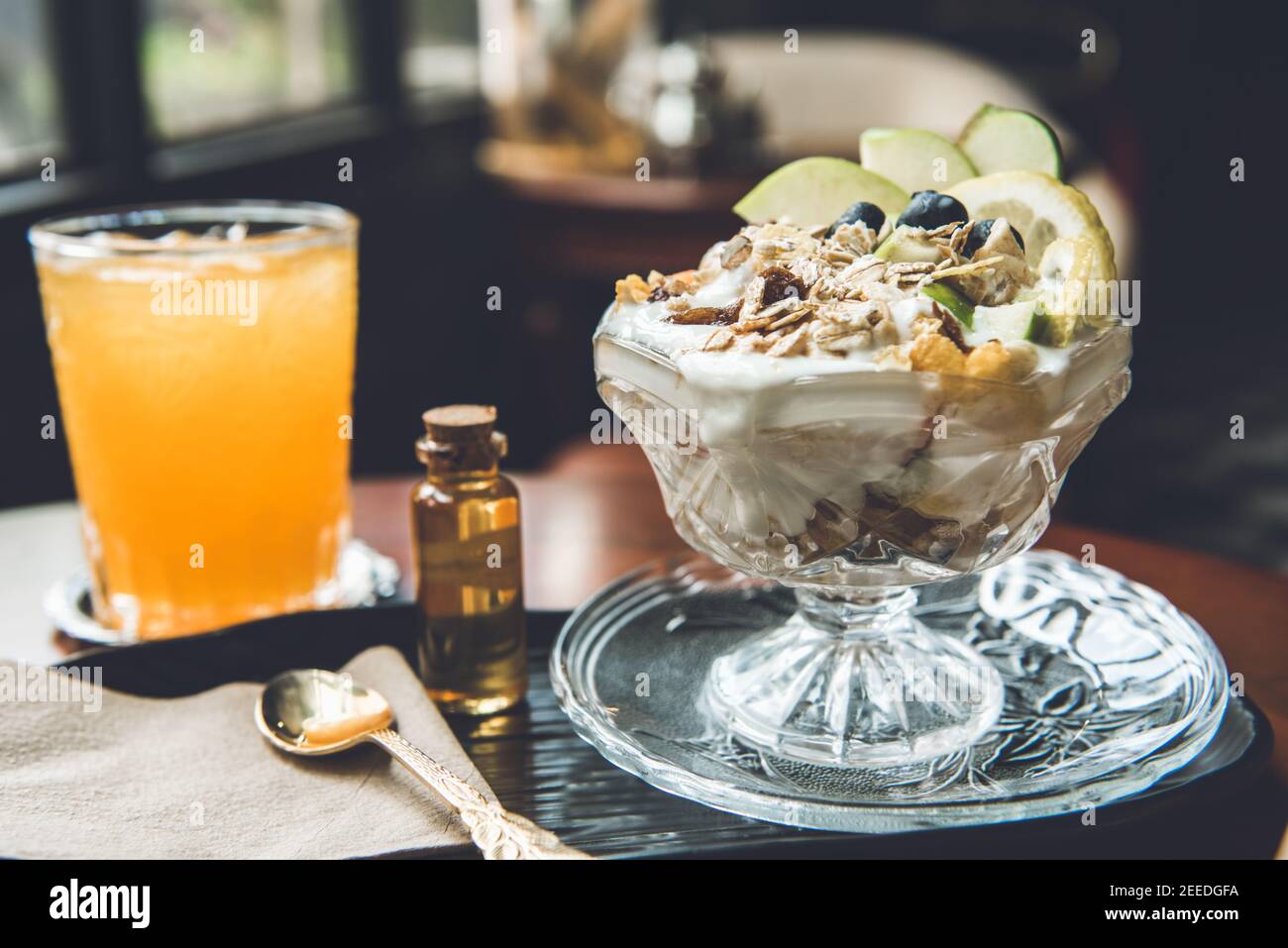 Beautiful appetizing healthy yogurt fruit salad topped with oat cereal ...