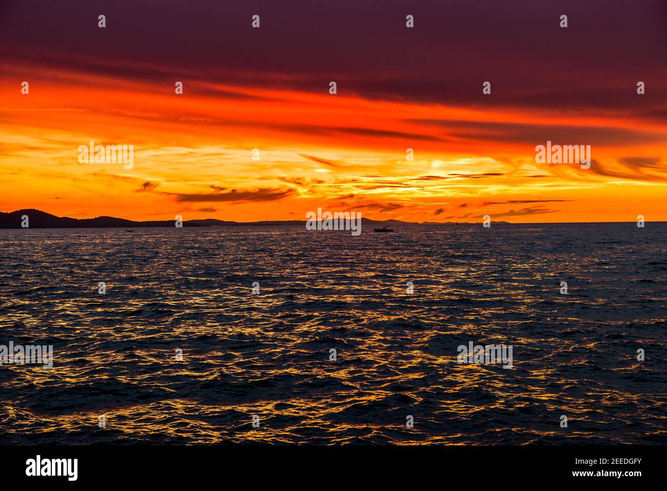Background with landscape of sunset over sea with reflection in the ...