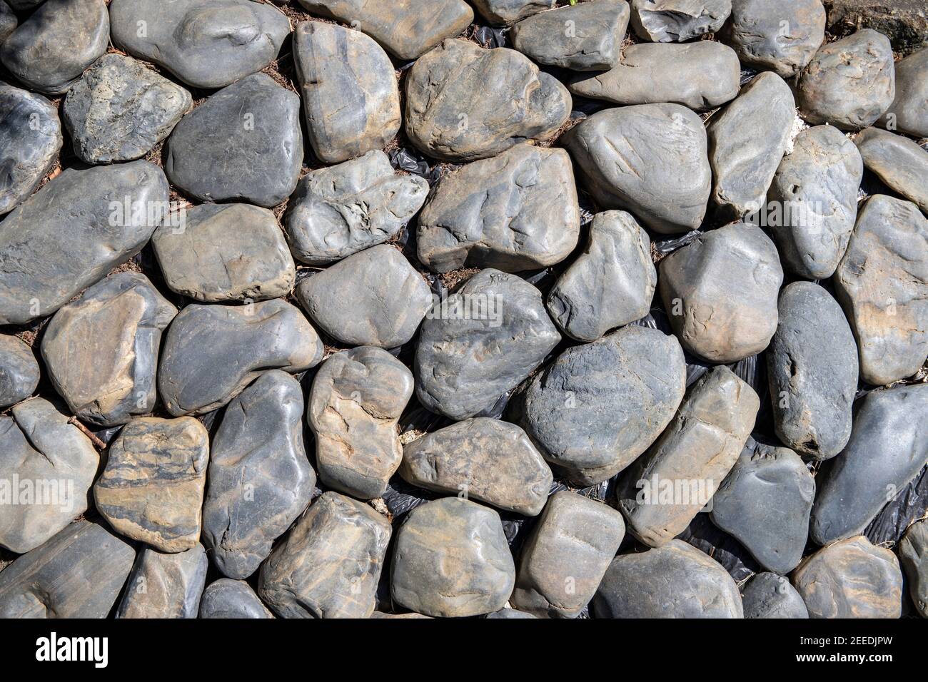 Grungy photo texture of grey stone. Round rocks top view background ...