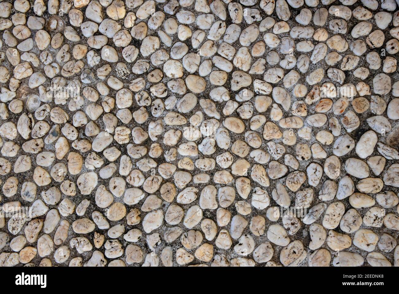 Natural photo texture of tiny pebble, top view background. White ...