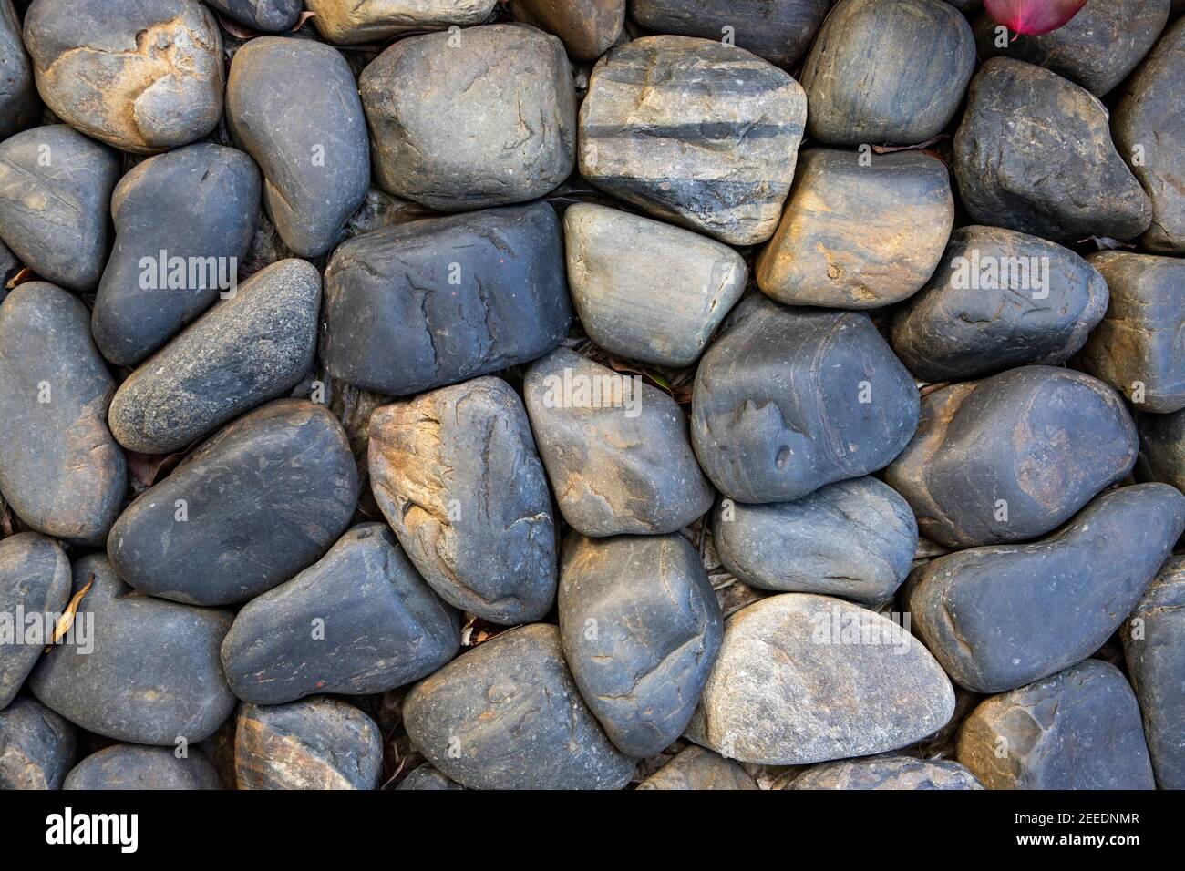 Grungy photo texture of black stone. Round rocks top view background ...