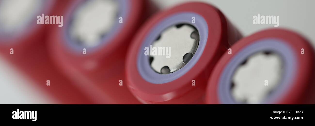 Red rechargeable lithium-ion batteries four pieces concept Stock Photo ...