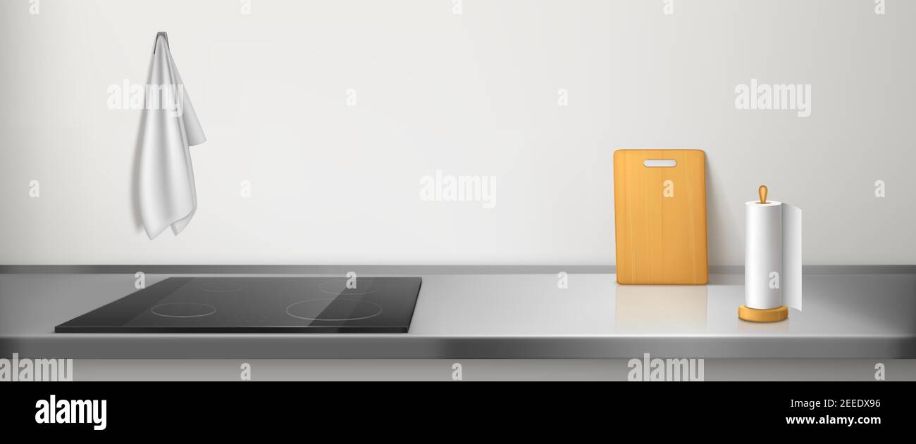 Electric stove on kitchen counter top with hang rag, paper towel and ...