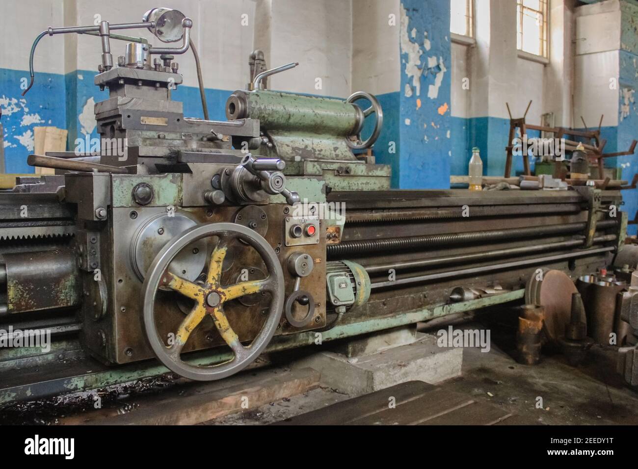 A large old lathe in a production shop in Russia. Turner's workplace ...