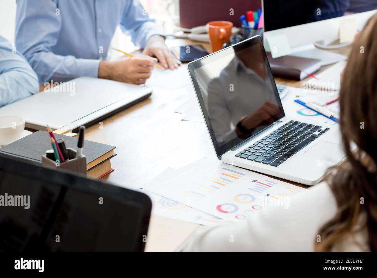 Business people working together at the table in shared coworking ...