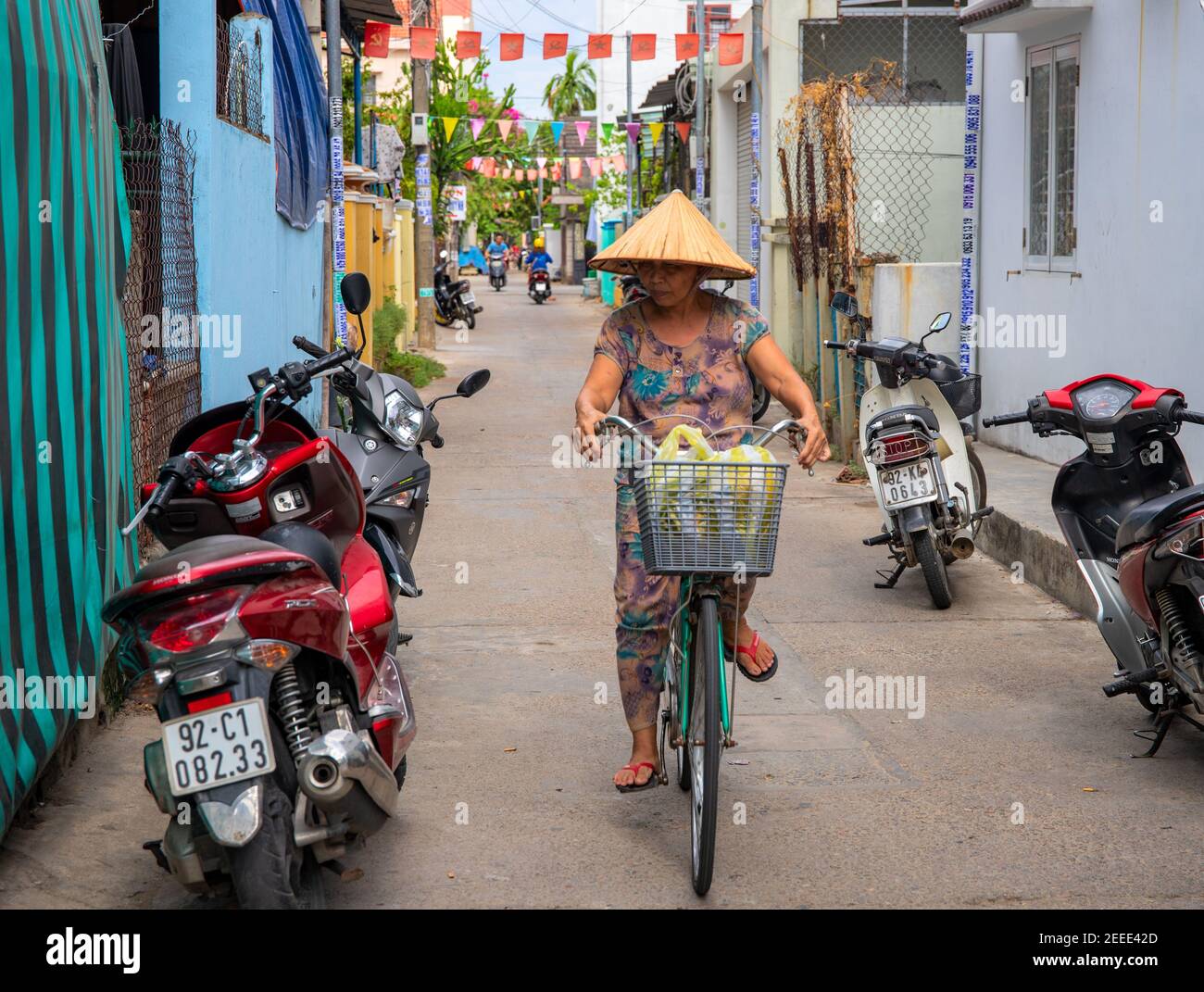 Hoi An, Vietnam - 28 Jul 2019: Woman in traditional vietnamese hat ...