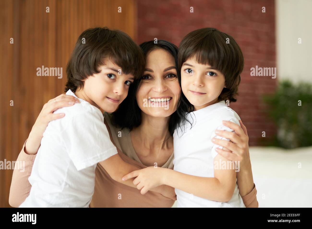 Portrait of two latin children, little twin boys smiling at camera and ...