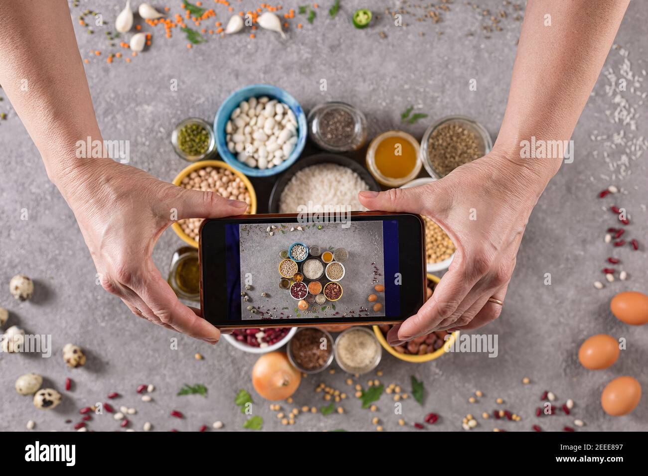 Woman taking pictures of diet foods with smartphone Stock Photo - Alamy