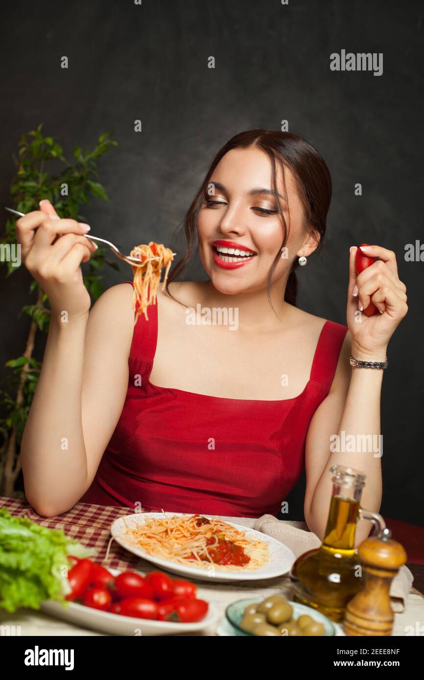 Woman eating pasta in restaurant hi-res stock photography and images ...