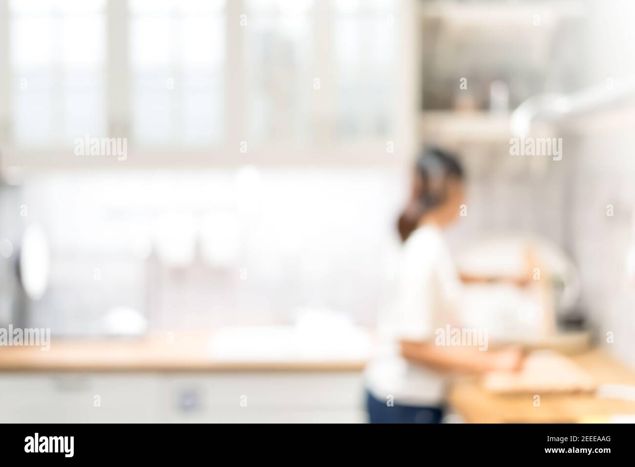 Blur modern kitchen interior with a person - for background Stock Photo ...