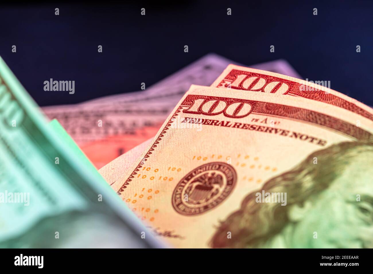 money background from dollars in neon light, close up Stock Photo - Alamy