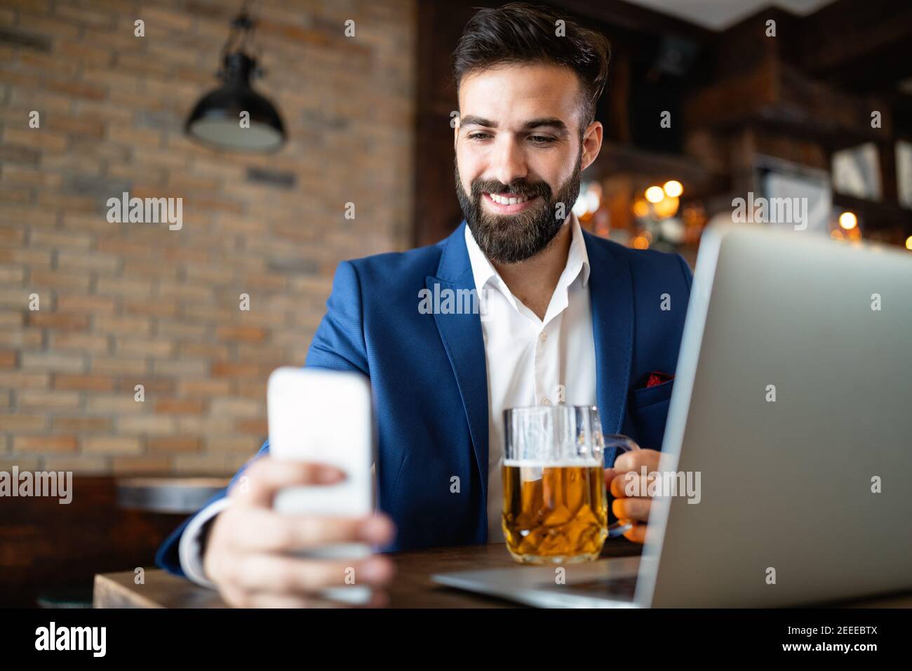 Young business man having a break in a restaurant. Work occupation ...