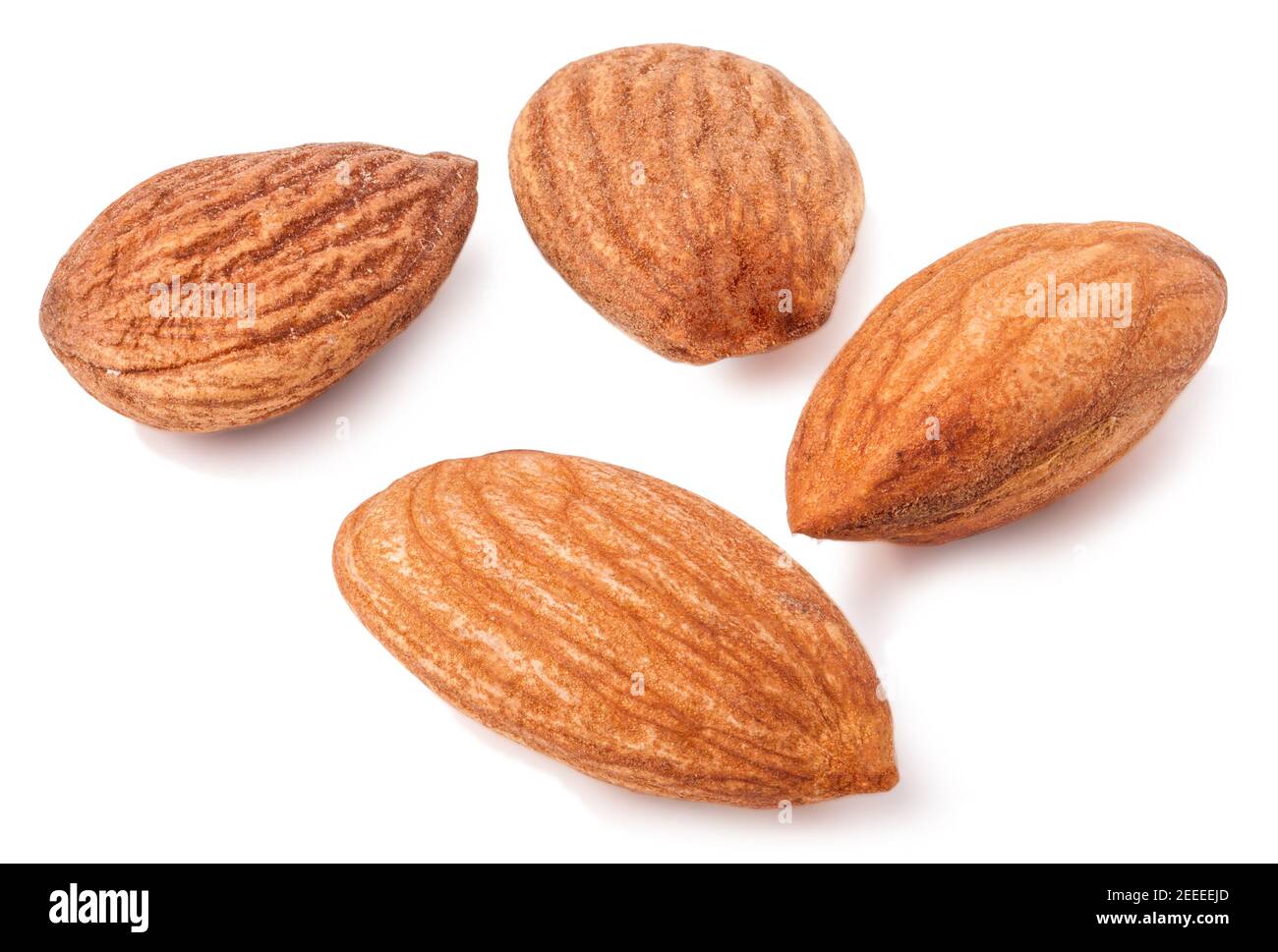 four almond isolated on white background close-up macro Stock Photo - Alamy