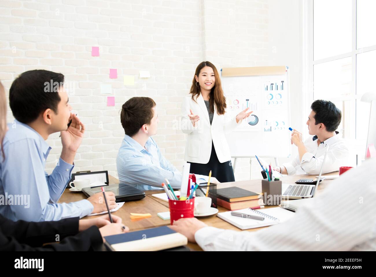 Asian business woman leader conducting company sales presentation in ...