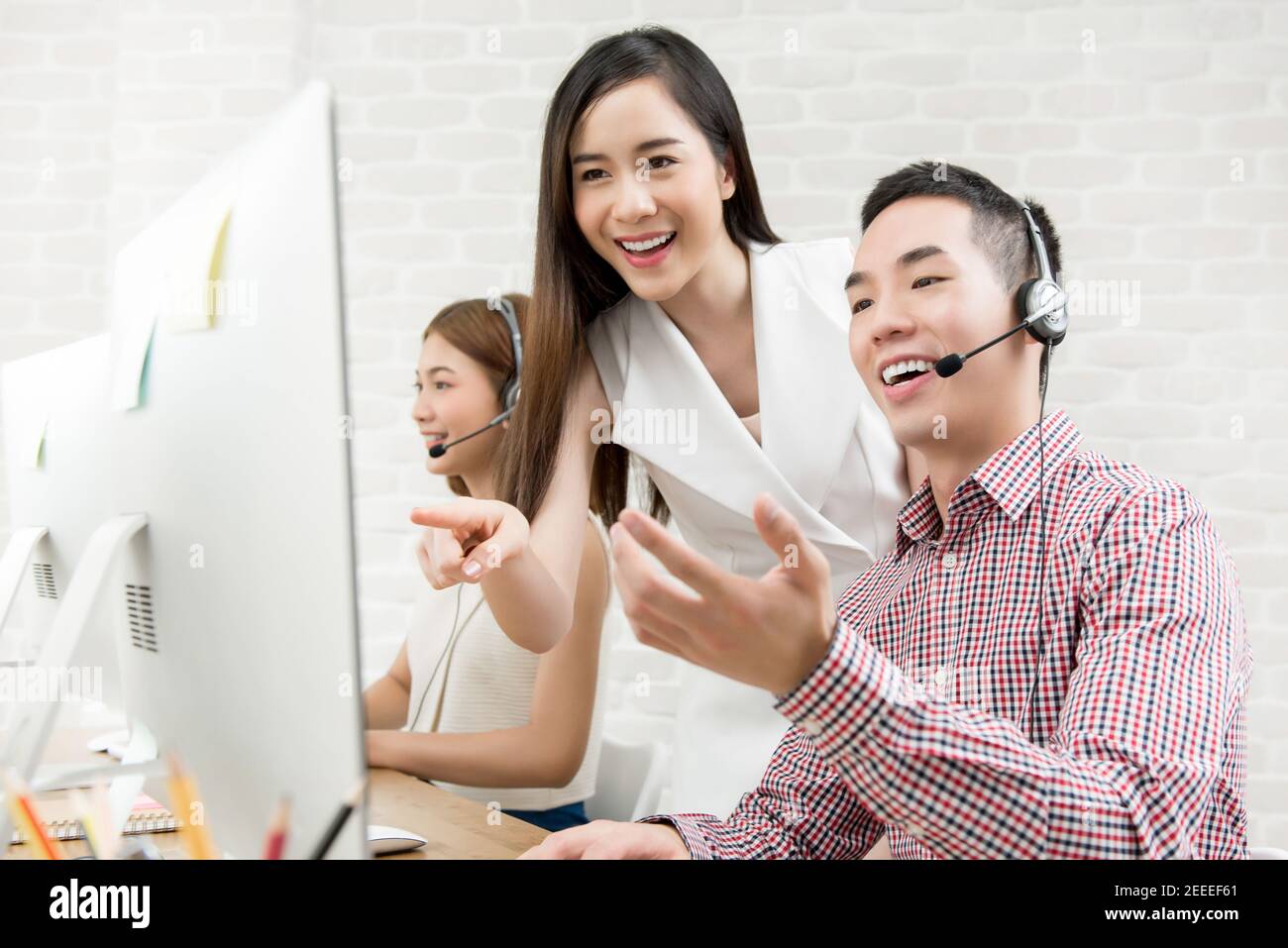 Asian female agent talking hi-res stock photography and images - Alamy