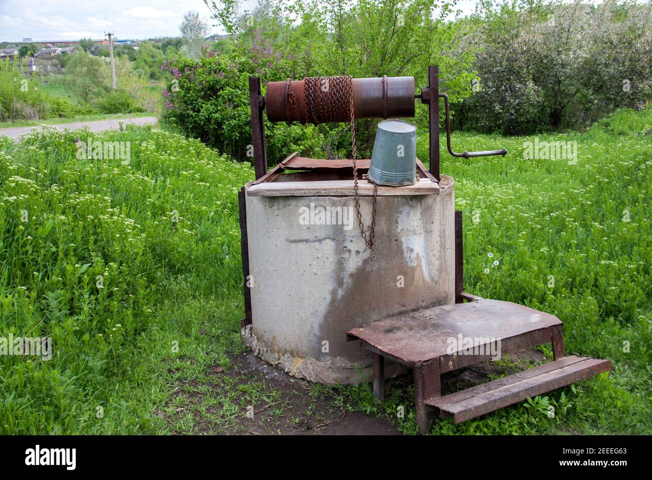 old well with water in the village Stock Photo - Alamy