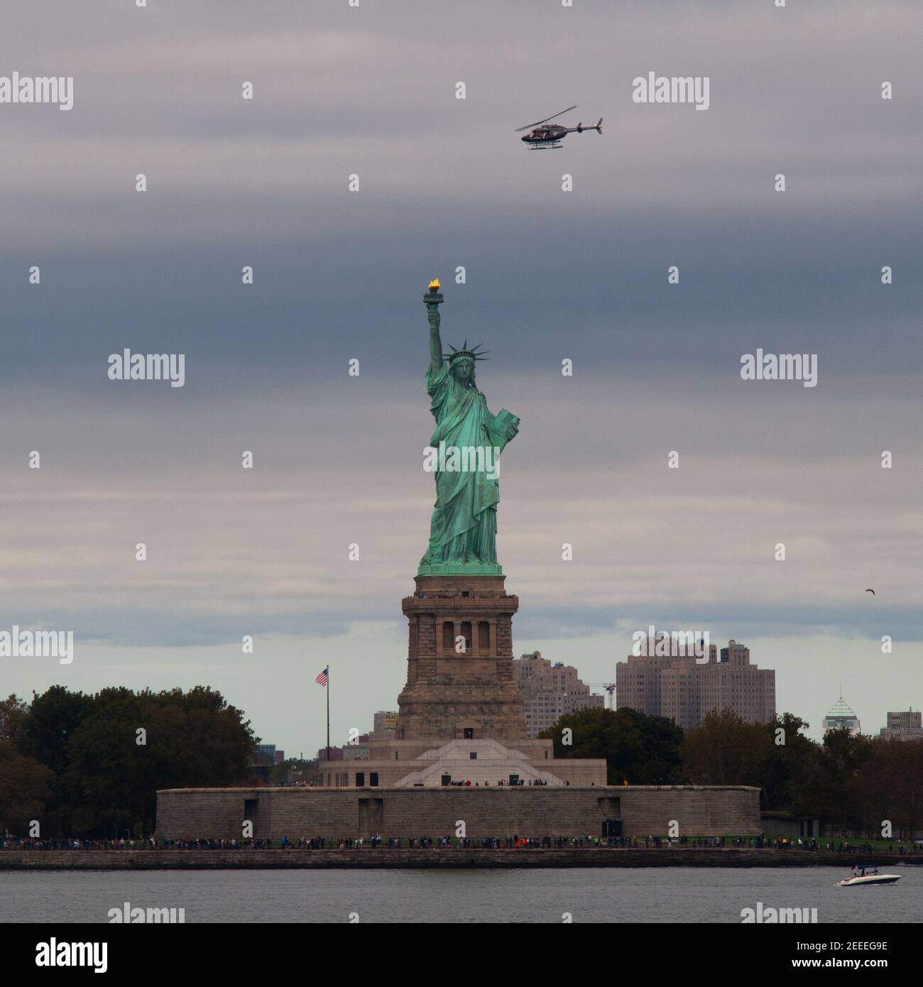 Helicopter Flying over the Statue of Liberty Stock Photo - Alamy