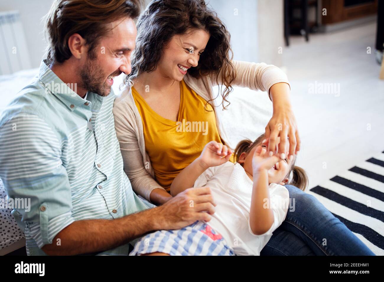 Happy family having fun times at home Stock Photo - Alamy