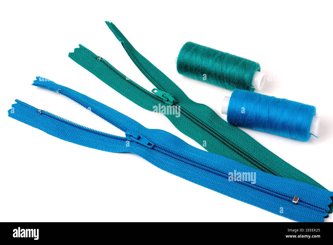 zipper with a spool of thread isolated on white background Stock Photo ...