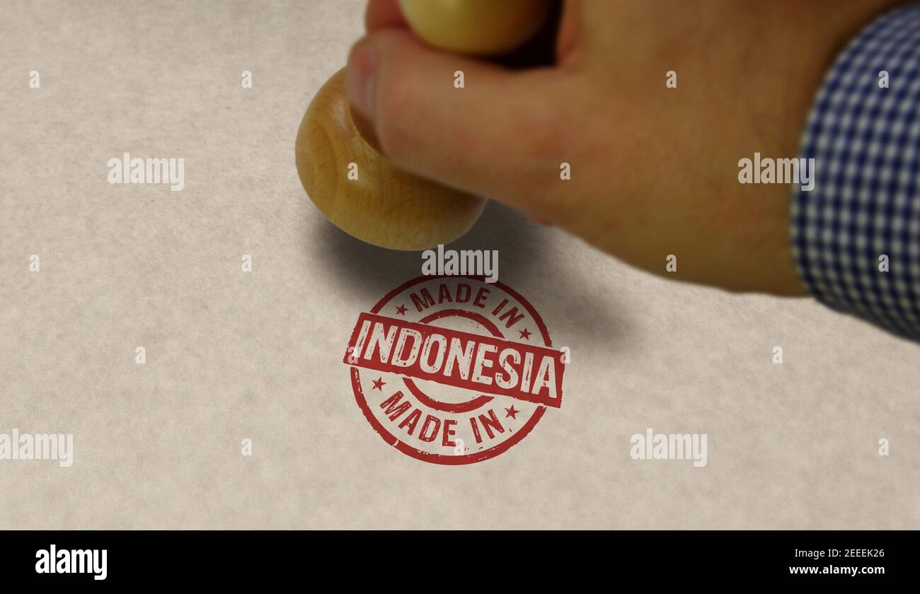 Made in Indonesia stamp and stamping hand. Factory, manufacturing and ...