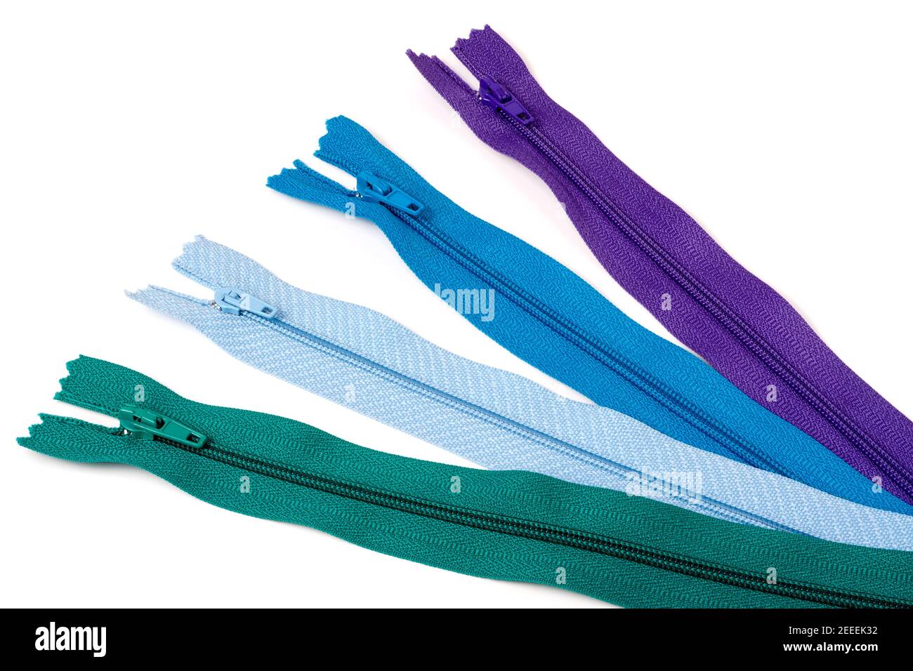 Four multi-colored zipper isolated on white background Stock Photo - Alamy