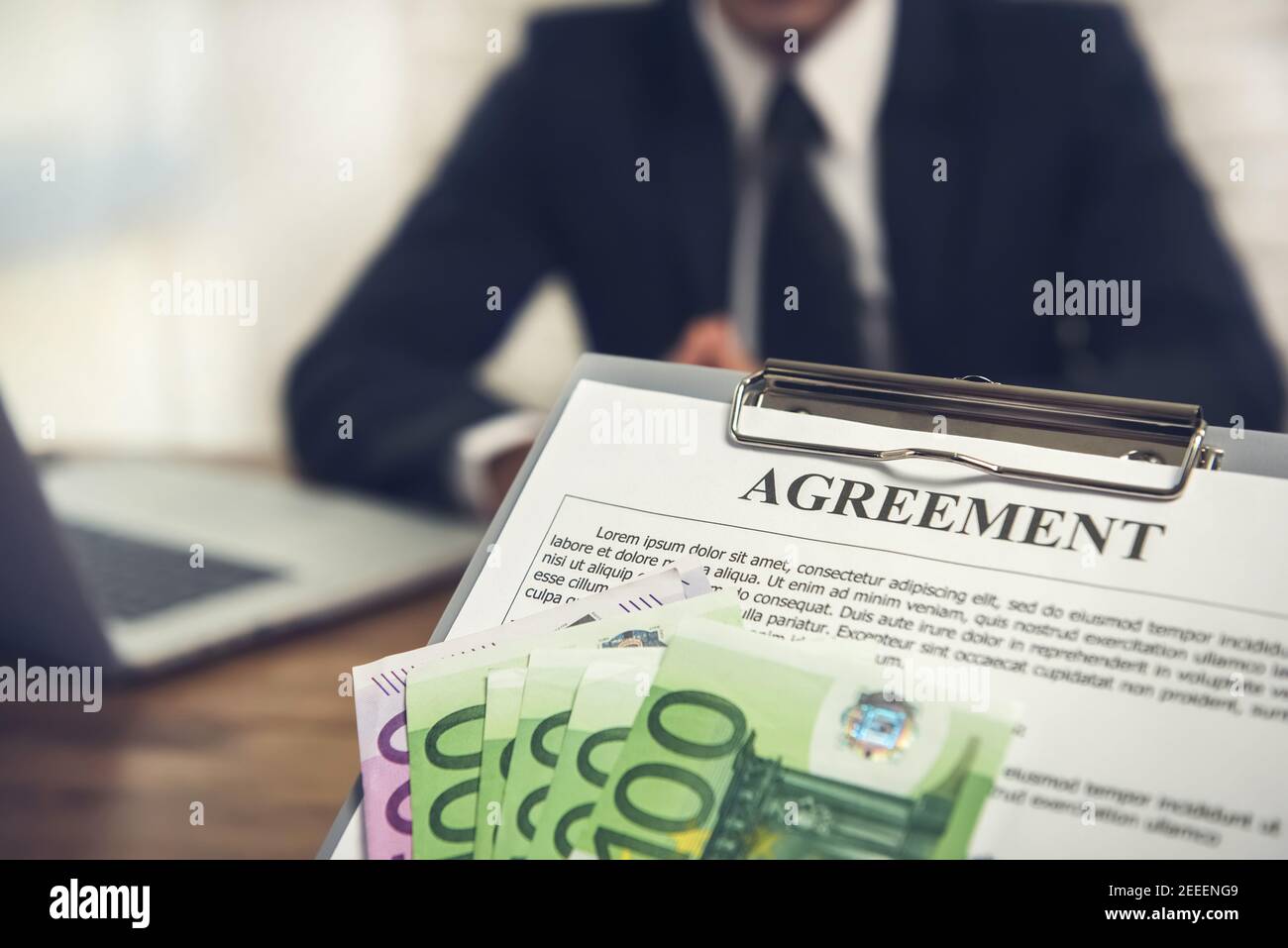 Agreement contract with money, Euro currency, given to a businessman ...