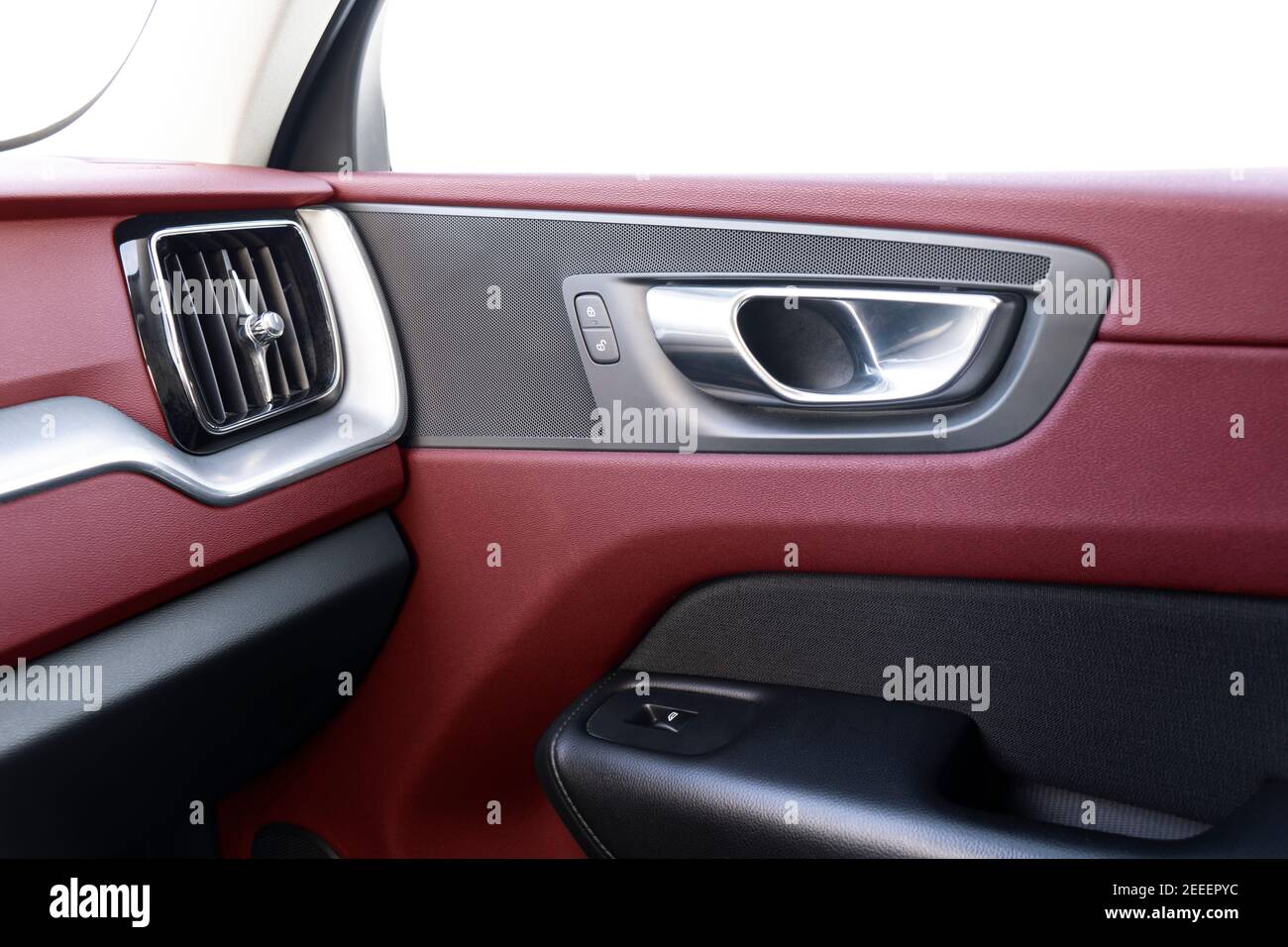 Car door handle inside the luxury modern car with red leather texture ...
